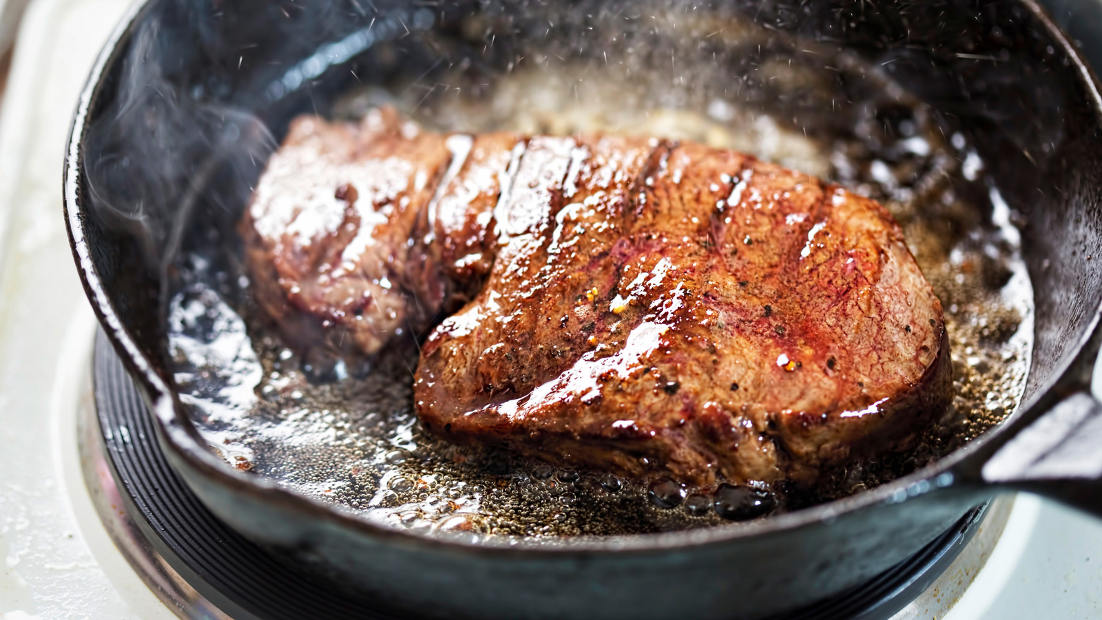 The Easy Trick To Avoid Your Steak From Taking On A Curved Bowl Shape