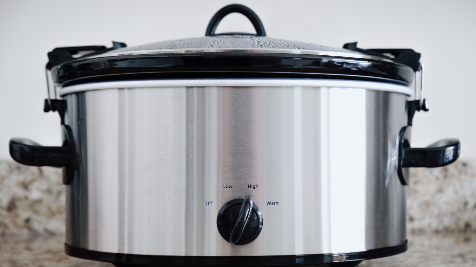 The Foil Trick That Lets Your Slow Cooker Make Two Dishes At Once